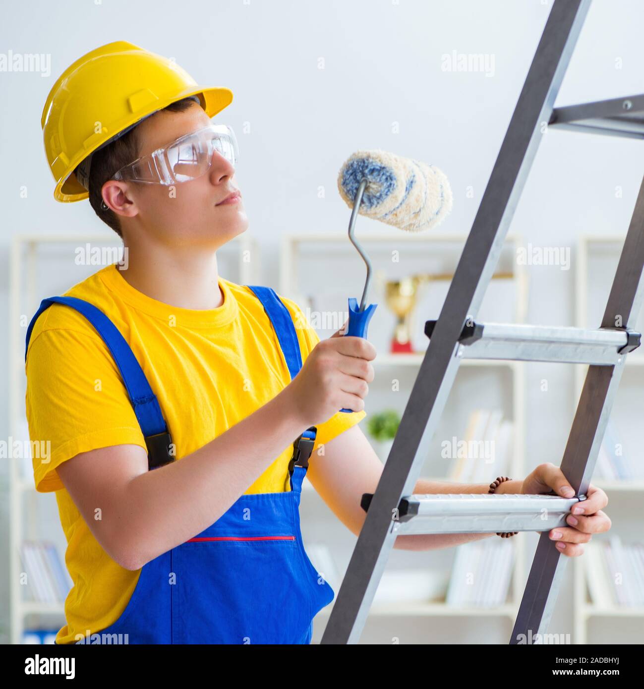 Painter working at home in refurbishment project Stock Photo - Alamy
