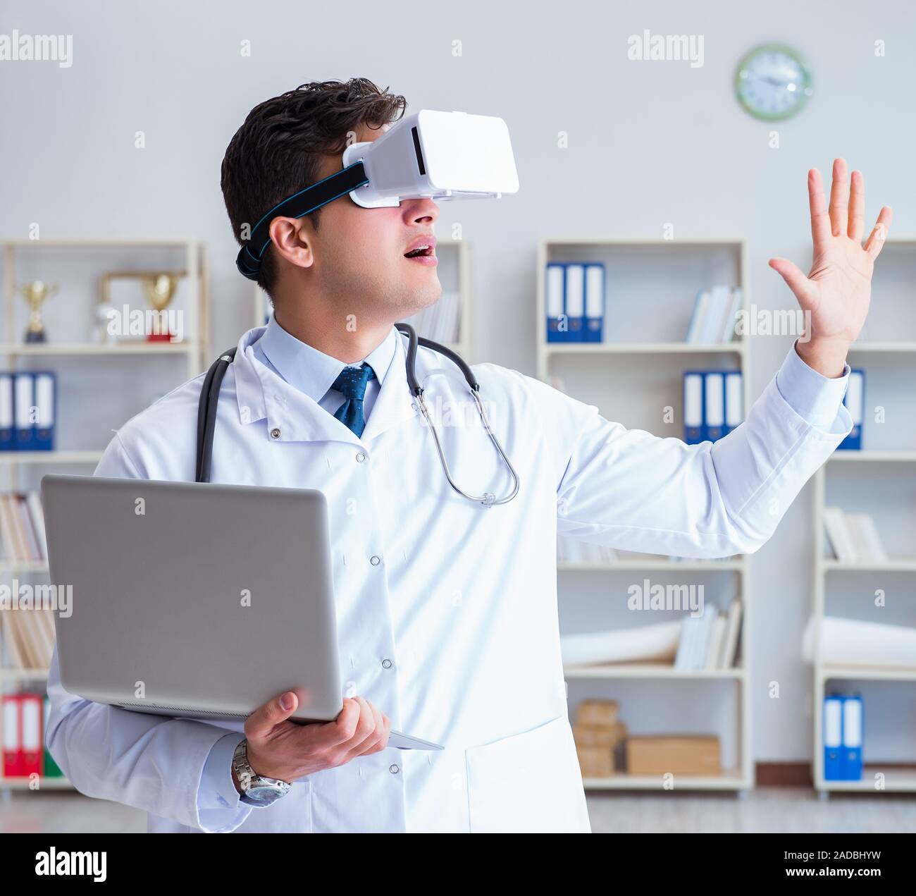 Young doctor with vr virtual reality headset working in the offi Stock ...