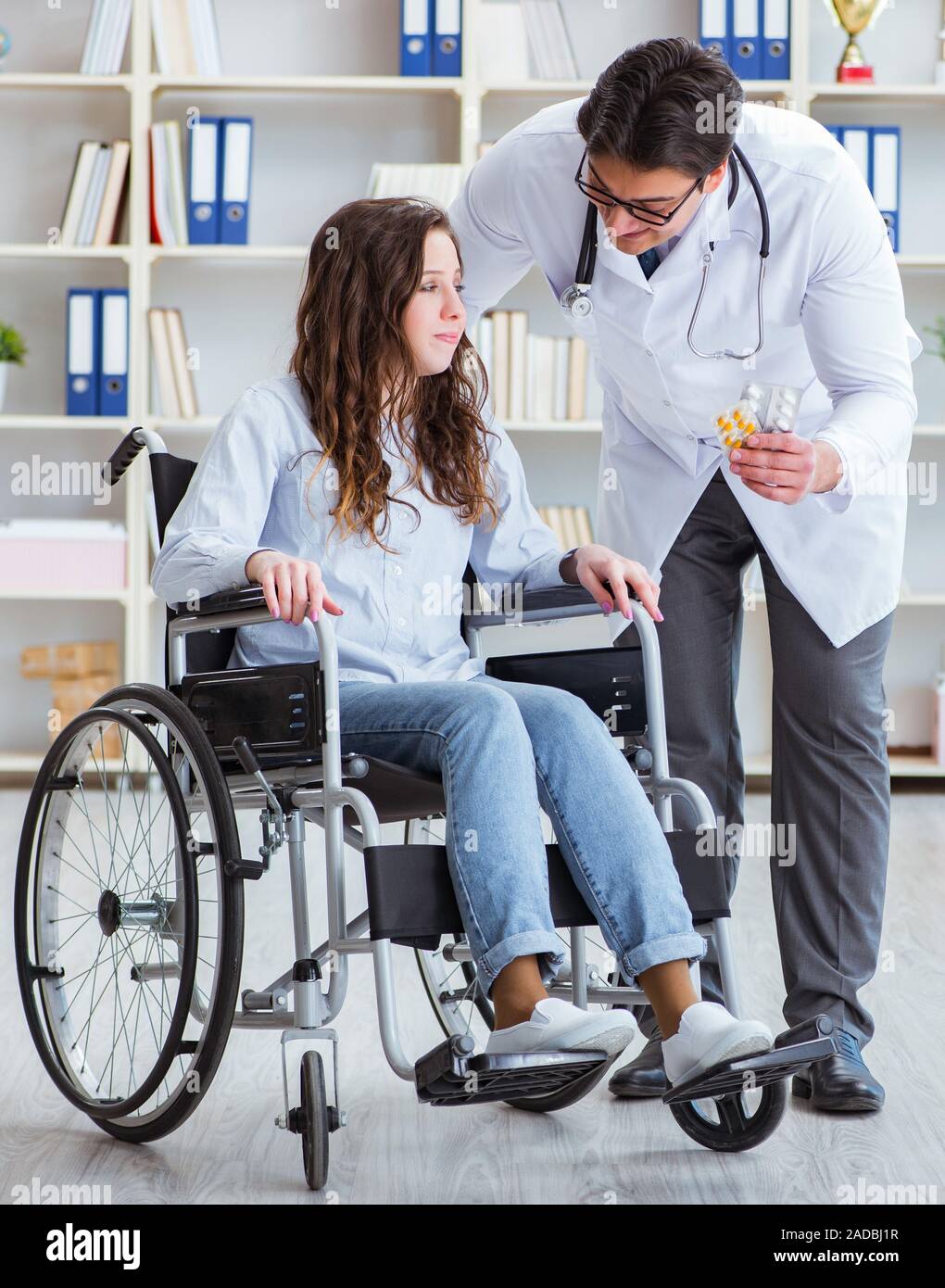 Disabled patient on wheelchair visiting doctor for regular check Stock ...