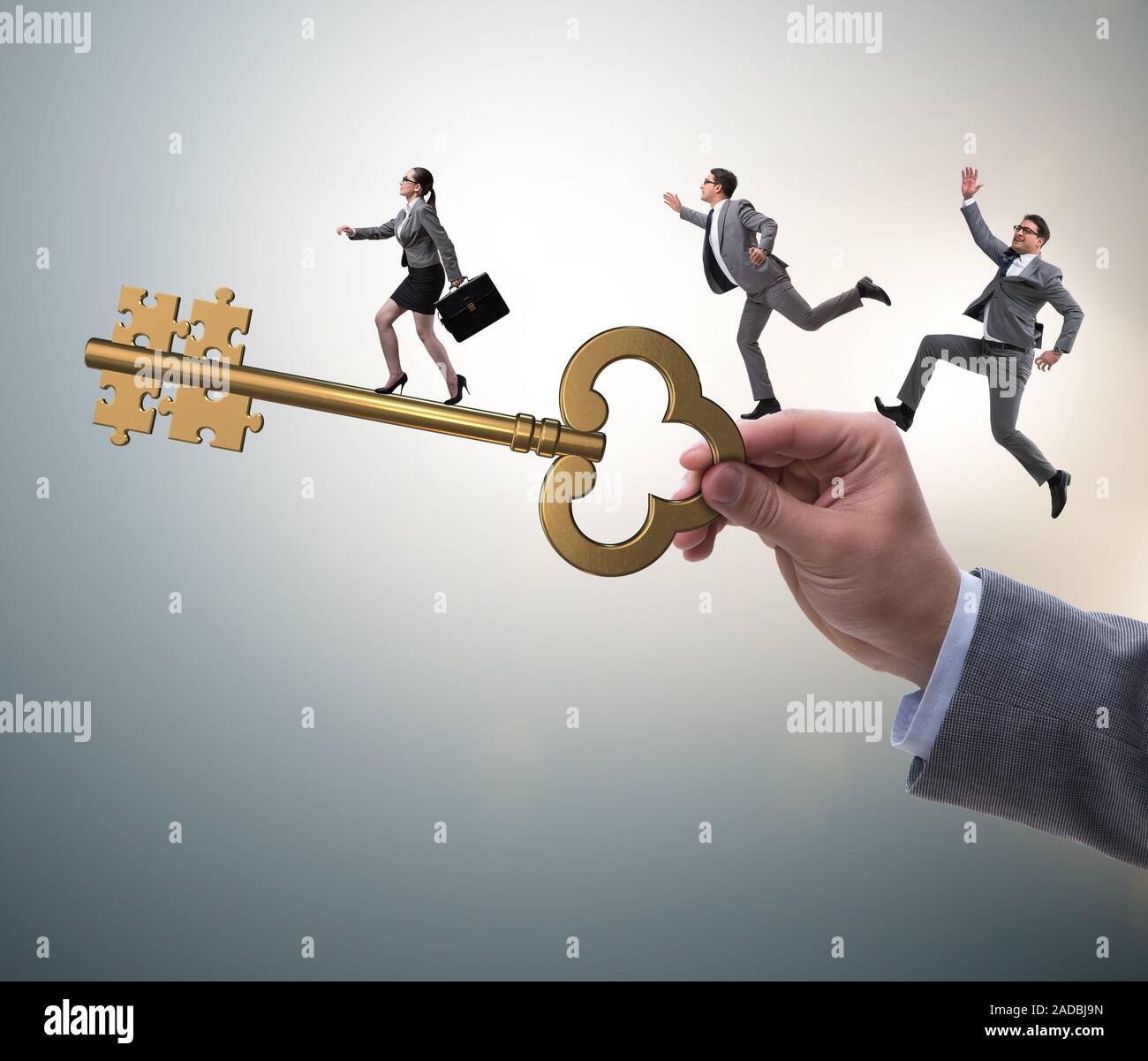 Business people chasing each other towards key to success Stock Photo ...