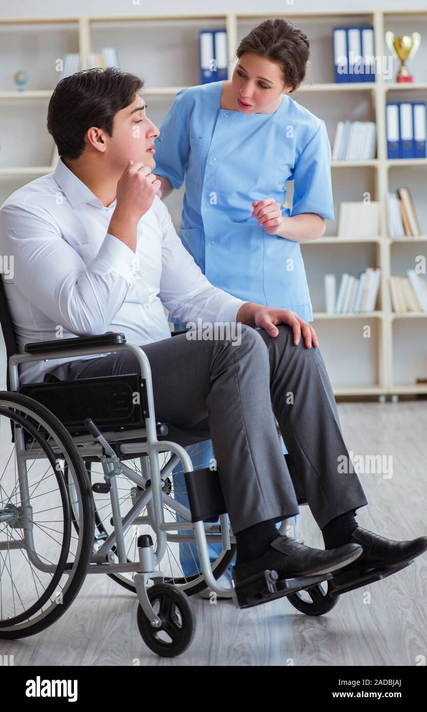 Disabled patient on wheelchair visiting doctor for regular check Stock ...