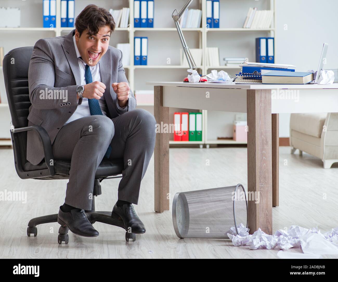 Businessman having fun taking a break in the office at work Stock Photo ...
