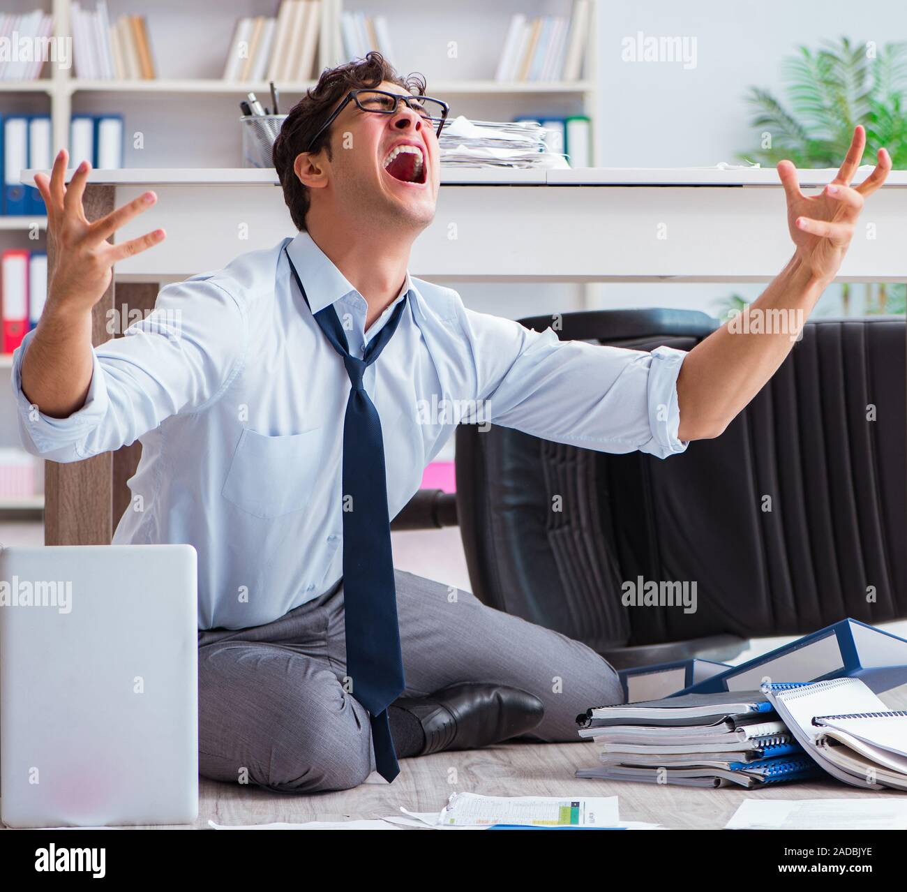 Bankrupt Businessman angry in the office floor Stock Photo - Alamy