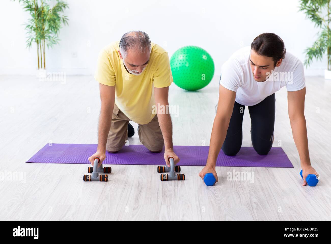 Senior man is doing rehab exercises at home hi-res stock photography ...