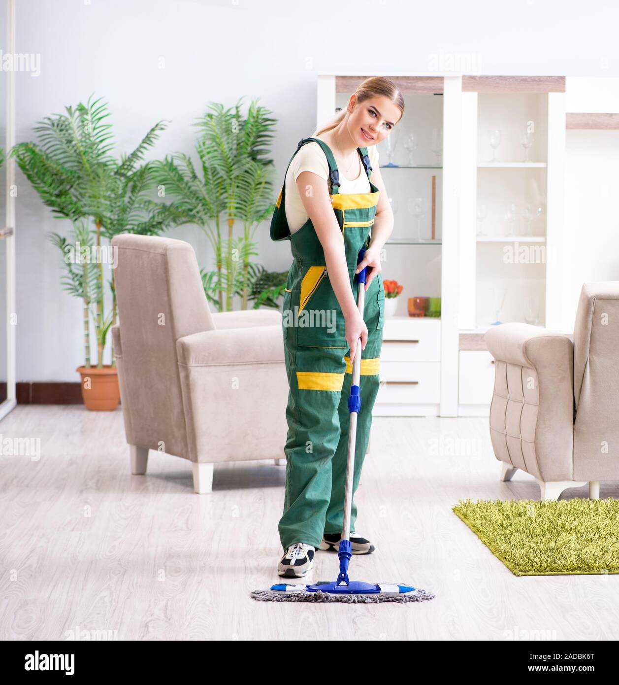 Woman female cleaner cleaning floor Stock Photo - Alamy