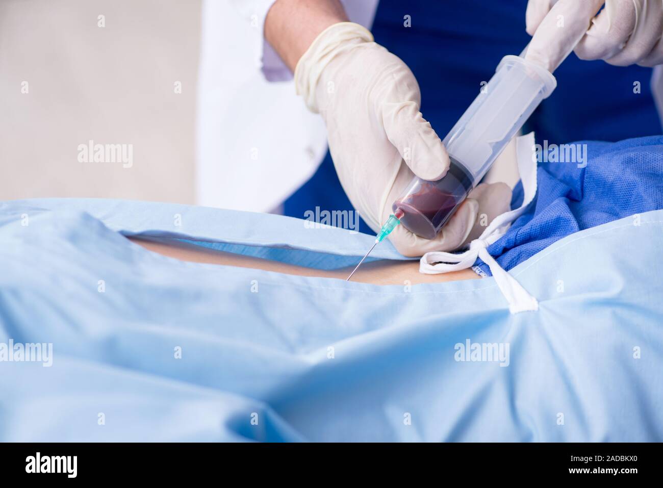 Female patient getting an injection in the clinic Stock Photo - Alamy