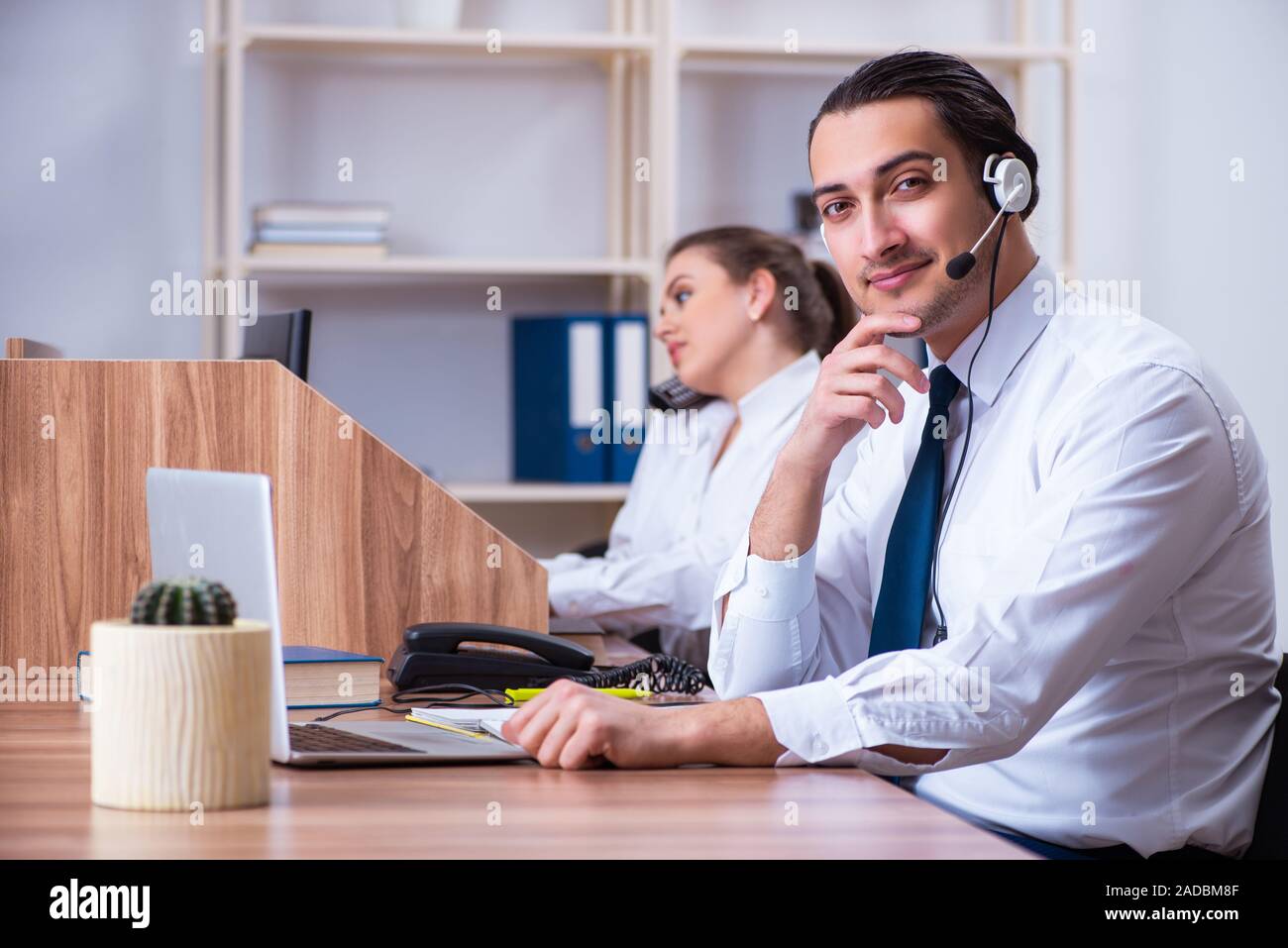 Call center operators working in the office Stock Photo - Alamy
