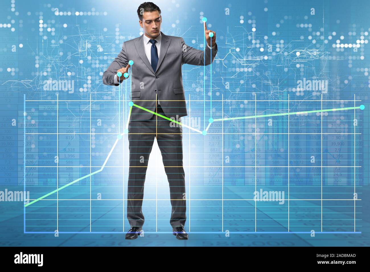 Businessman controlling the market with strings Stock Photo - Alamy