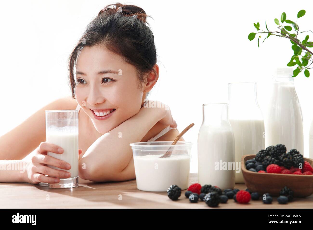 Young women drinking milk Stock Photo - Alamy