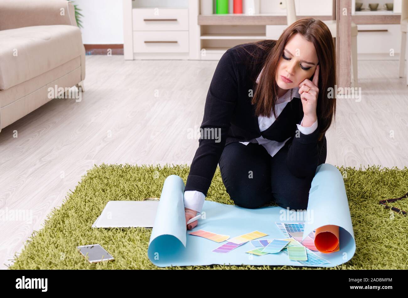 Female designer working in the office Stock Photo - Alamy