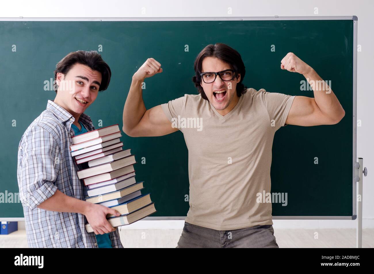 Two male students in the classroom Stock Photo - Alamy