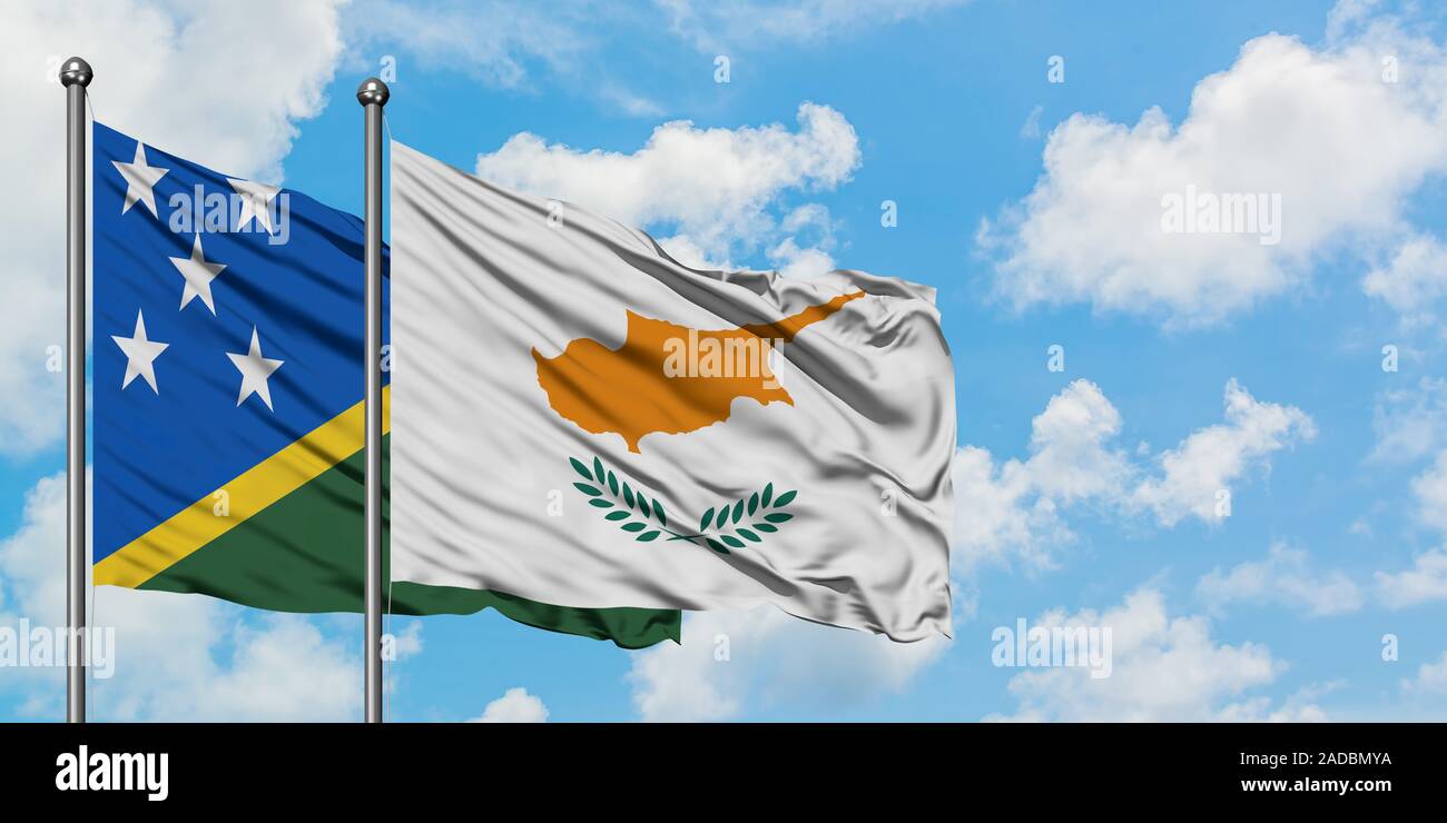 Solomon Islands and Cyprus flag waving in the wind against white cloudy ...
