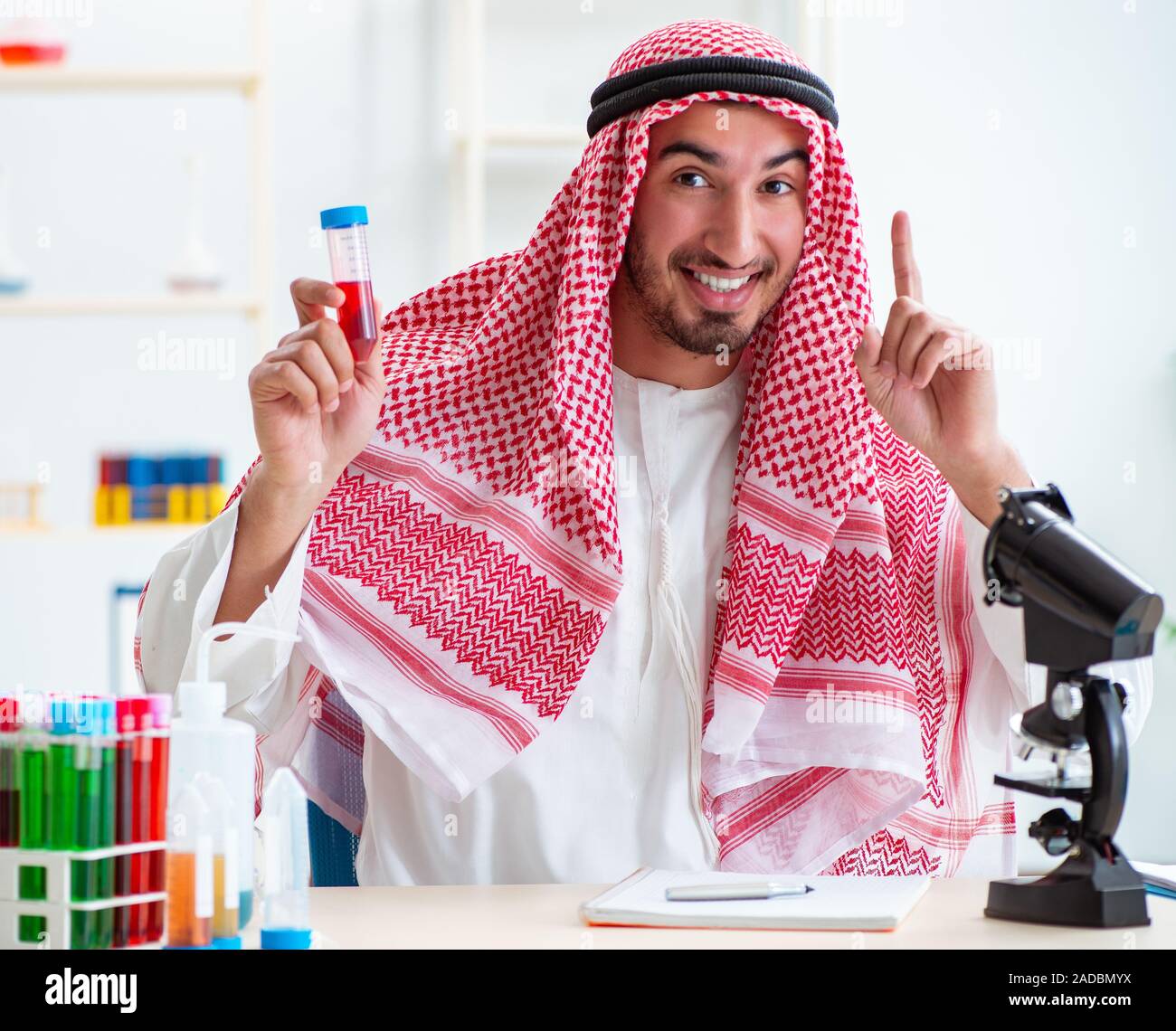Arab chemist working in the lab office Stock Photo - Alamy