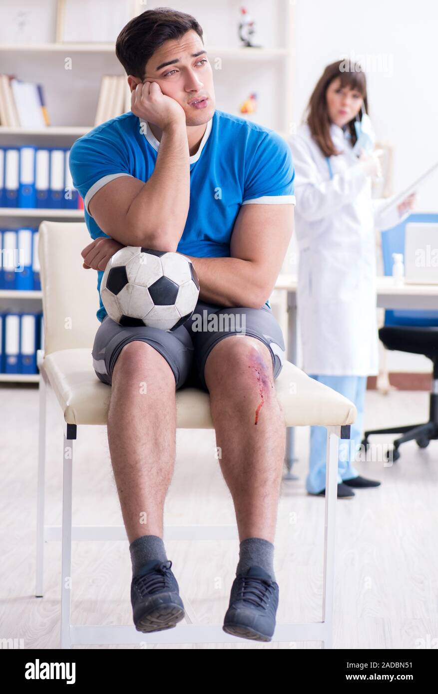 Football soccer player visiting doctor after injury Stock Photo - Alamy