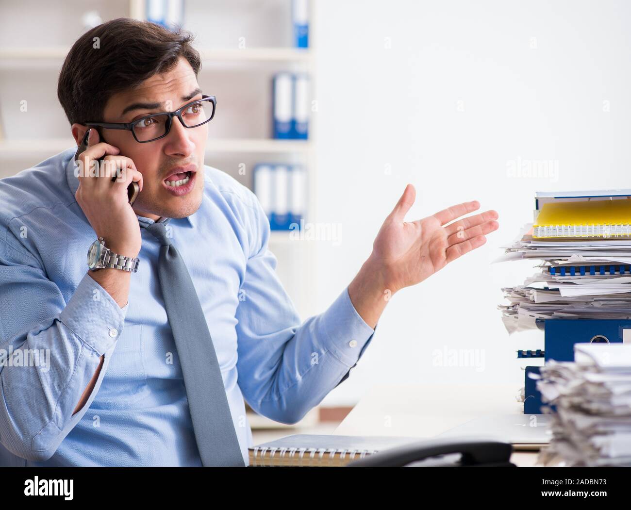 Extremely busy Businessman working in office Stock Photo - Alamy