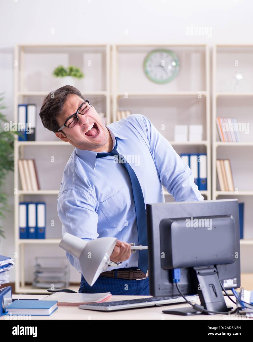 Angry Businessman frustrated with too much work Stock Photo - Alamy