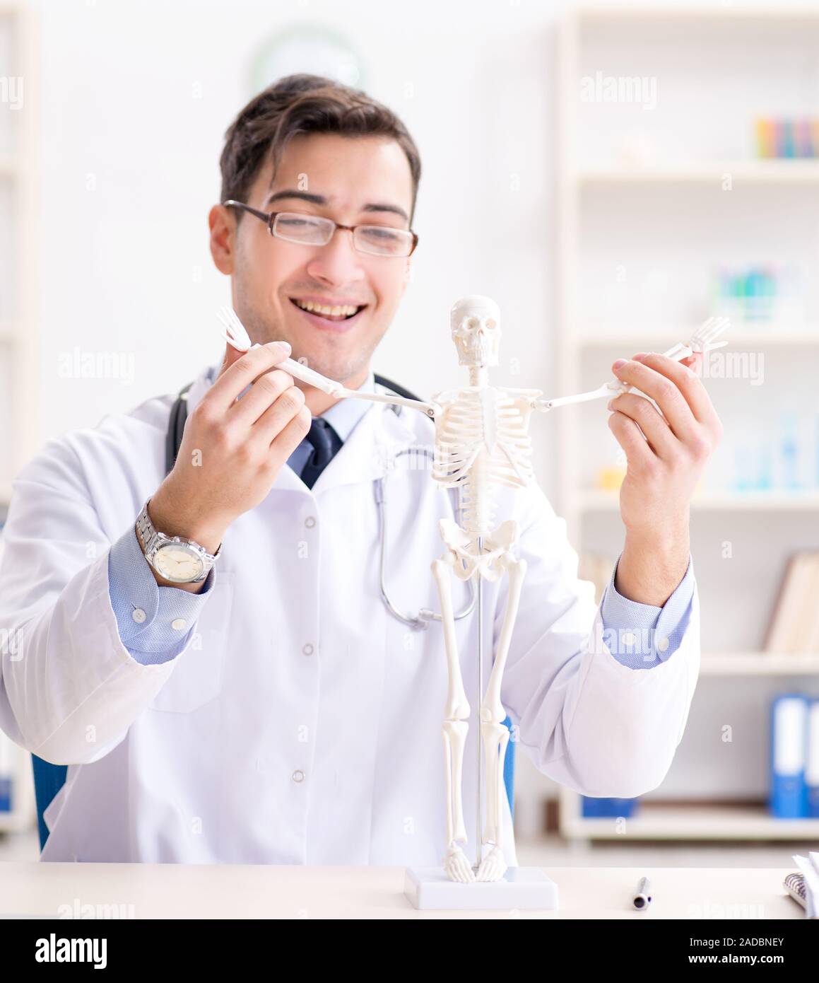 Doctor explaining human body on skeleton Stock Photo - Alamy