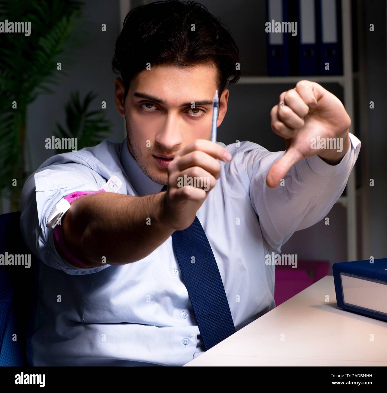 The employee relieving stress from overtime with drugs narcotics Stock ...