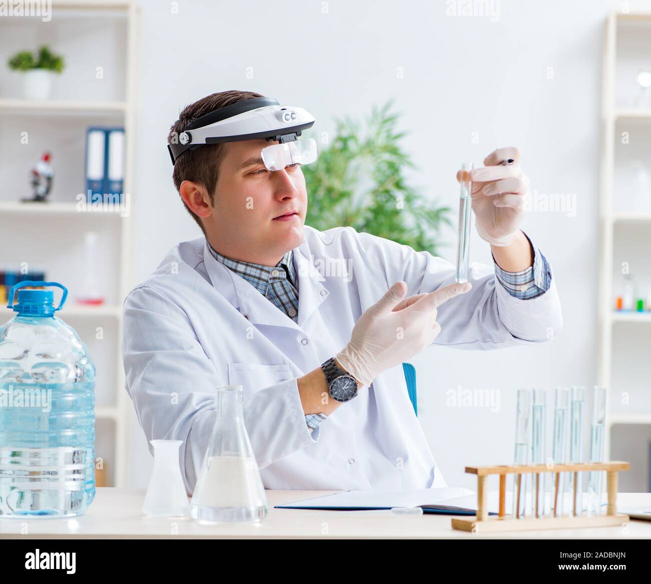 Young chemist student experimenting in lab Stock Photo - Alamy