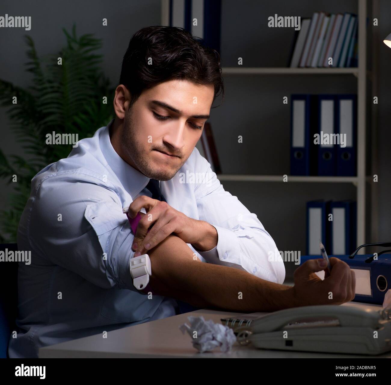 The employee relieving stress from overtime with drugs narcotics Stock ...