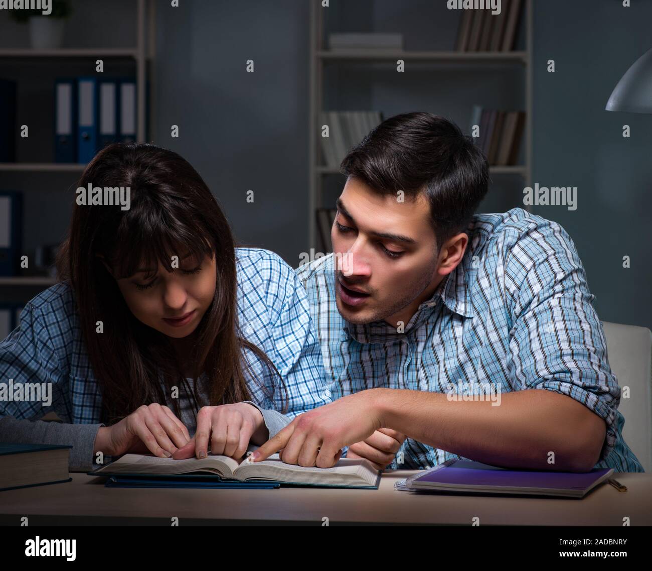 Two students studying late at night Stock Photo - Alamy