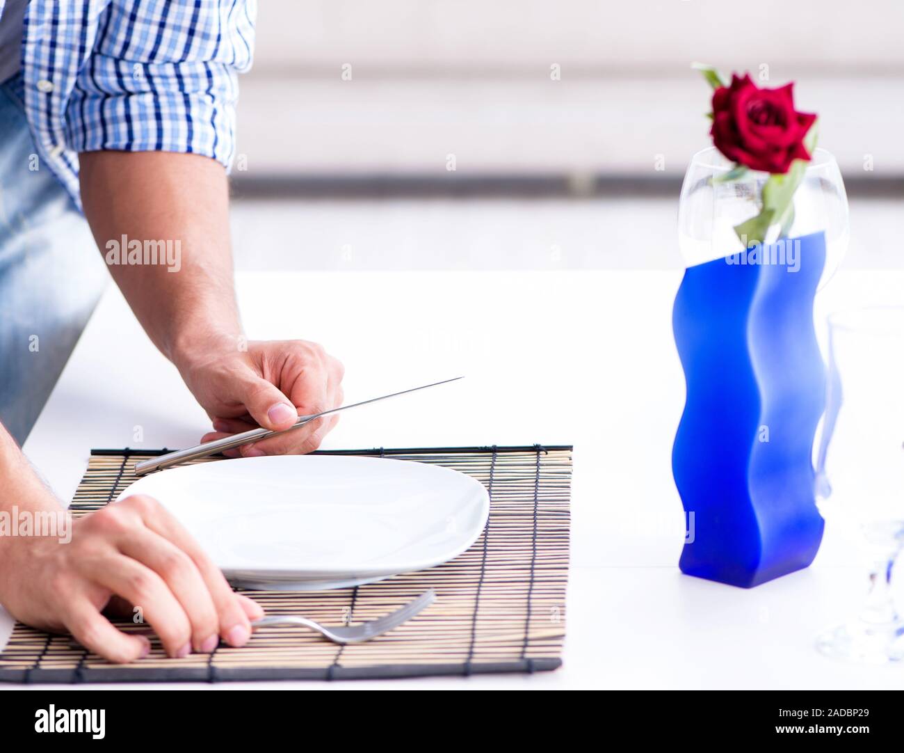The man alone preparing for romantic date with his sweetheart Stock ...