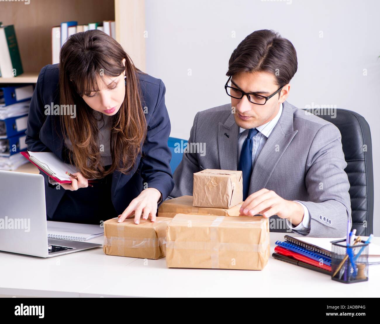 Business people receiving new mail and parcels Stock Photo - Alamy