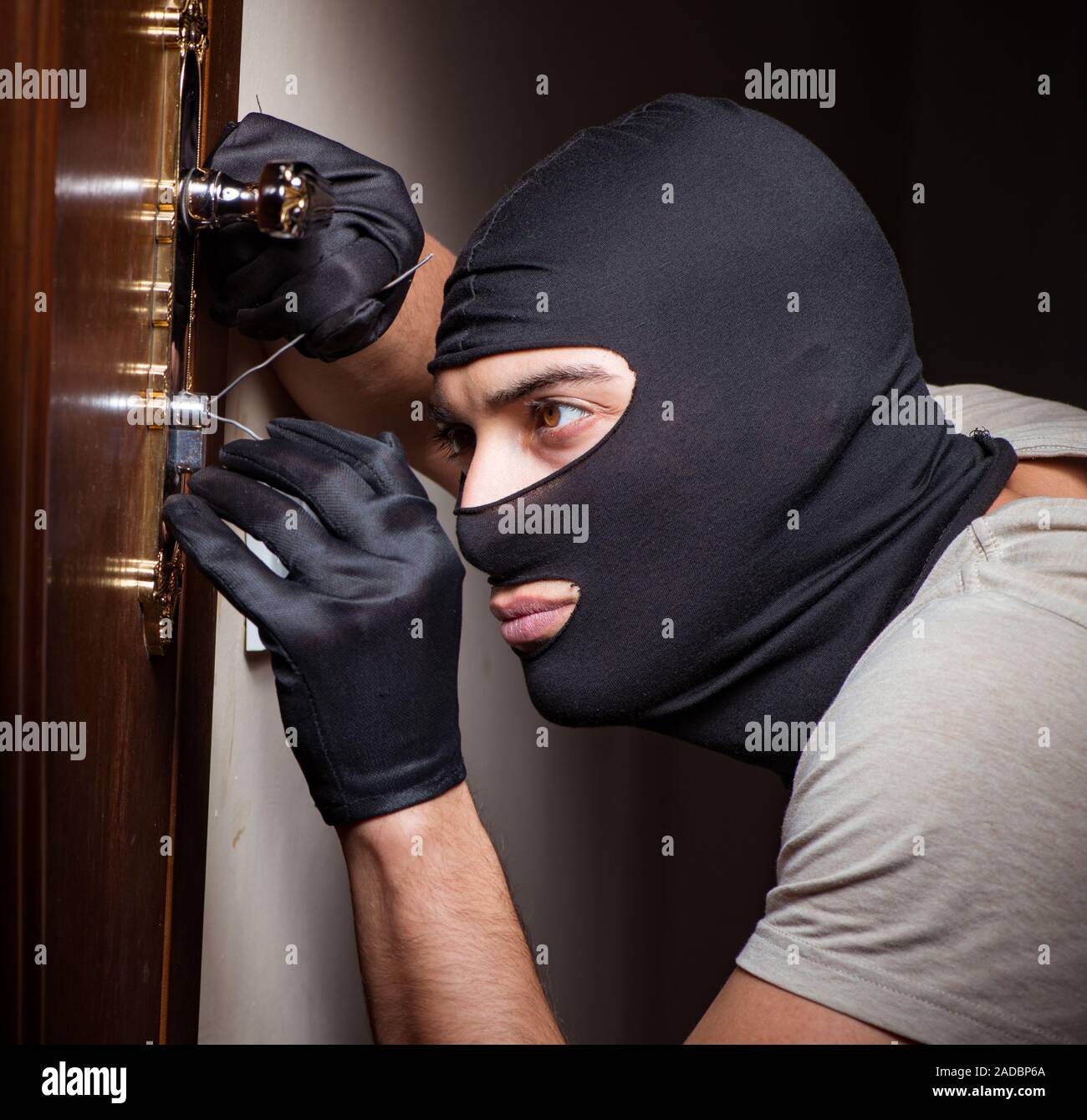 Burglar wearing balaclava mask at crime scene Stock Photo - Alamy
