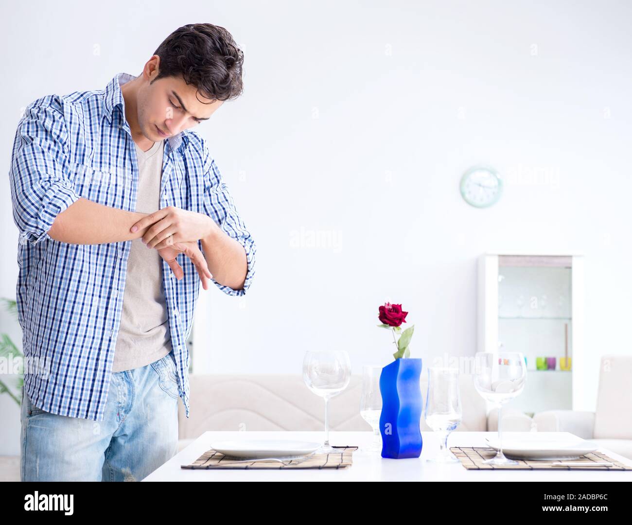 The man alone preparing for romantic date with his sweetheart Stock ...