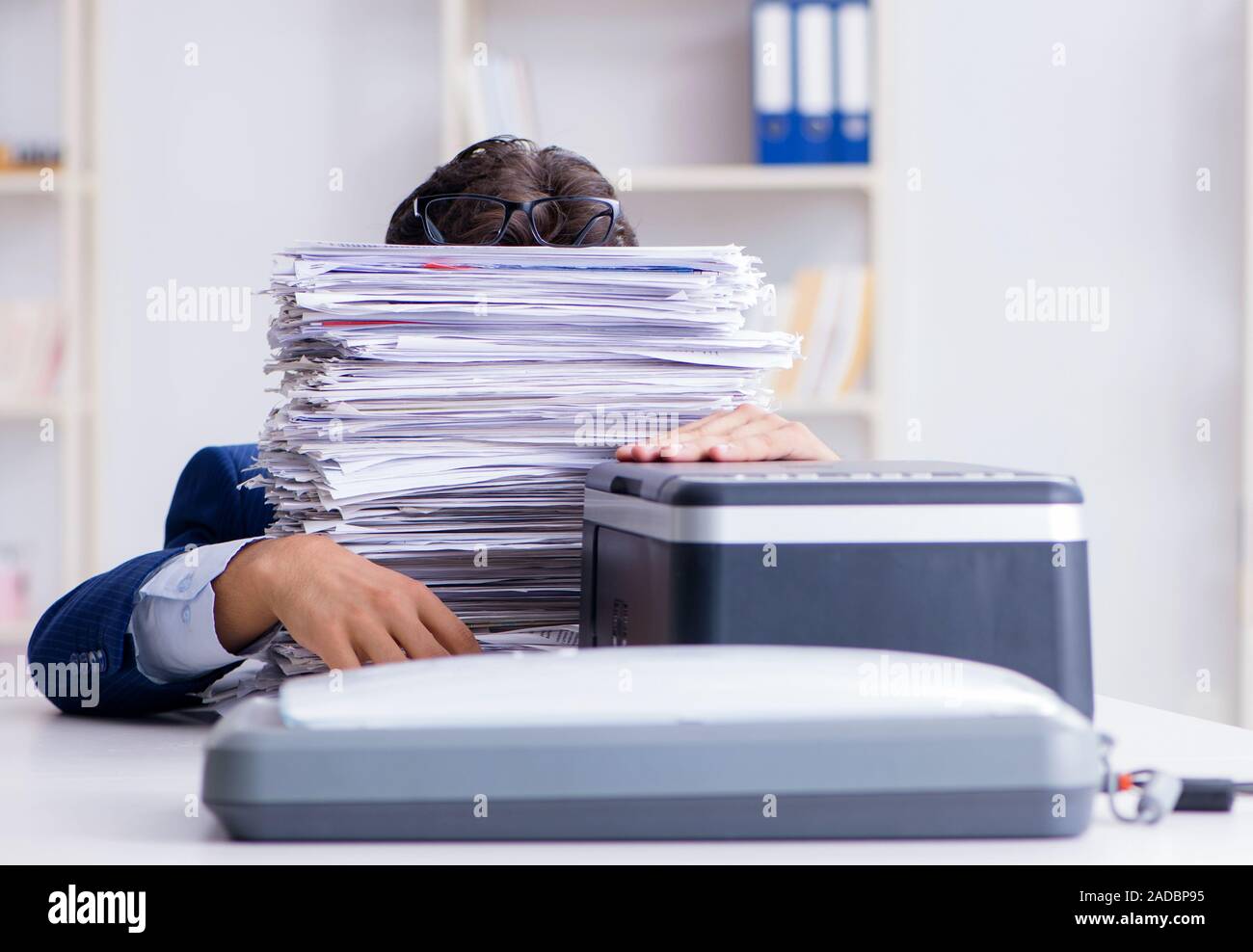 Businessman making copies in copying machine Stock Photo - Alamy