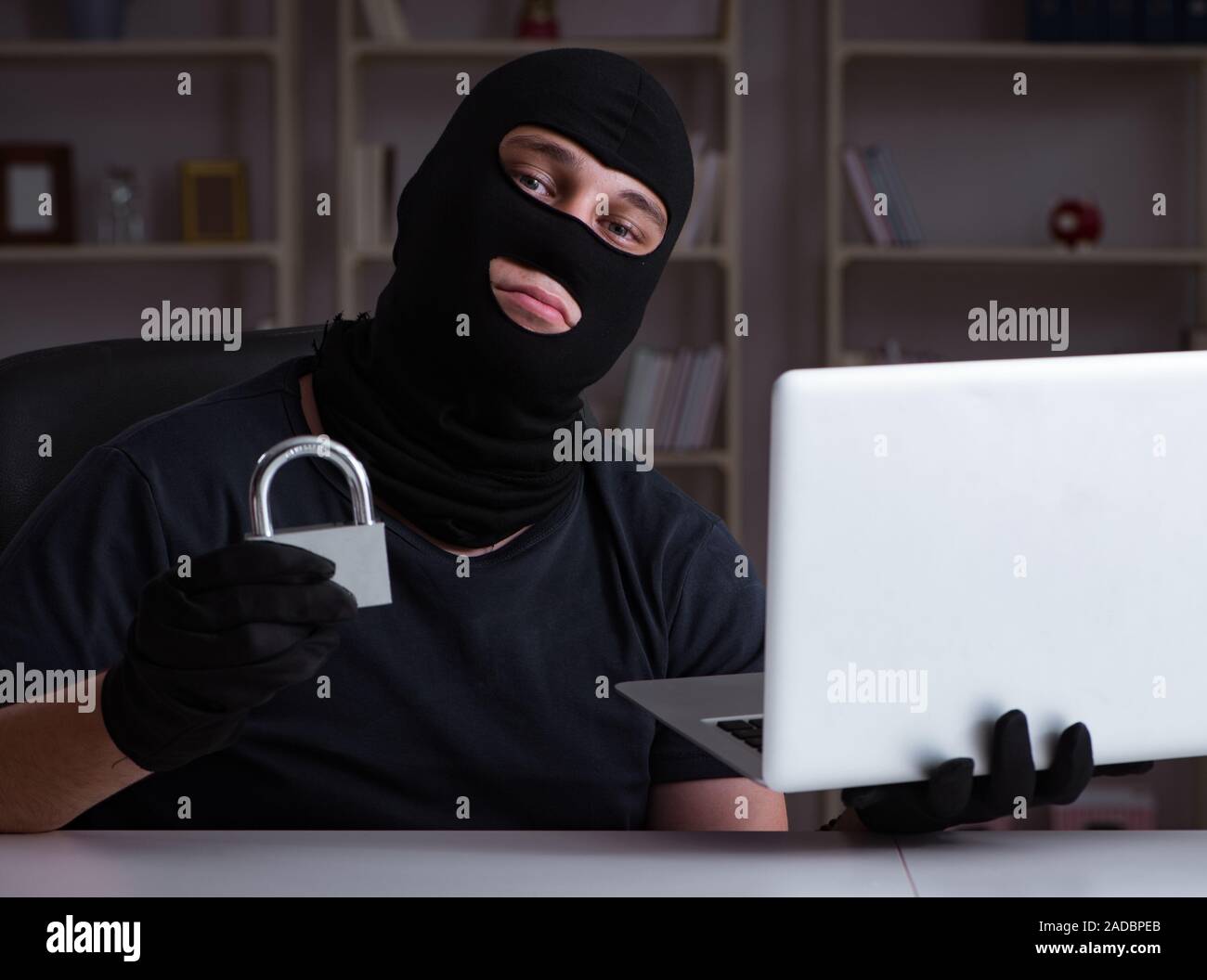 Hacker hacking computer late at night Stock Photo - Alamy