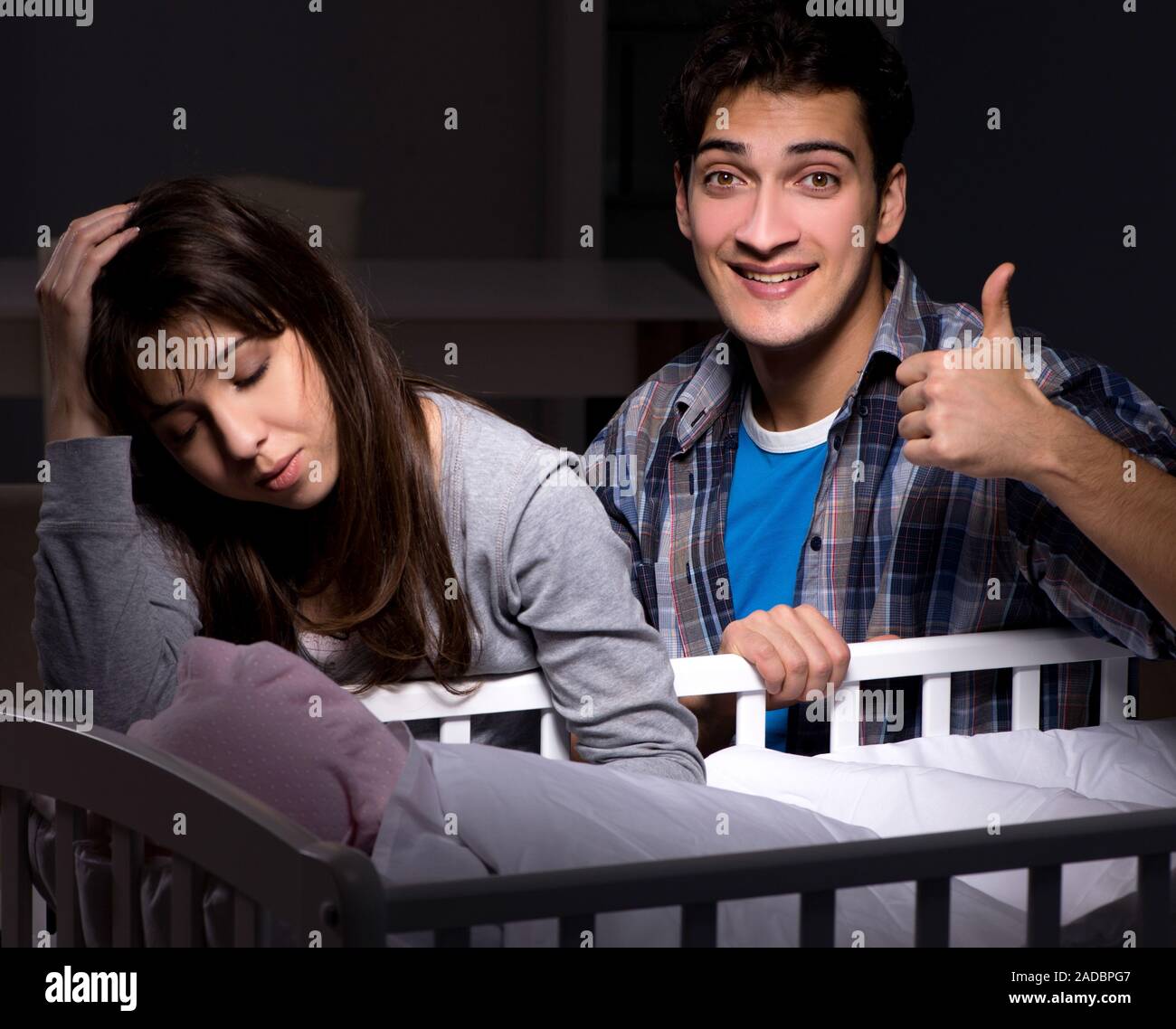 Young parents sleepless with newborn baby at night Stock Photo - Alamy