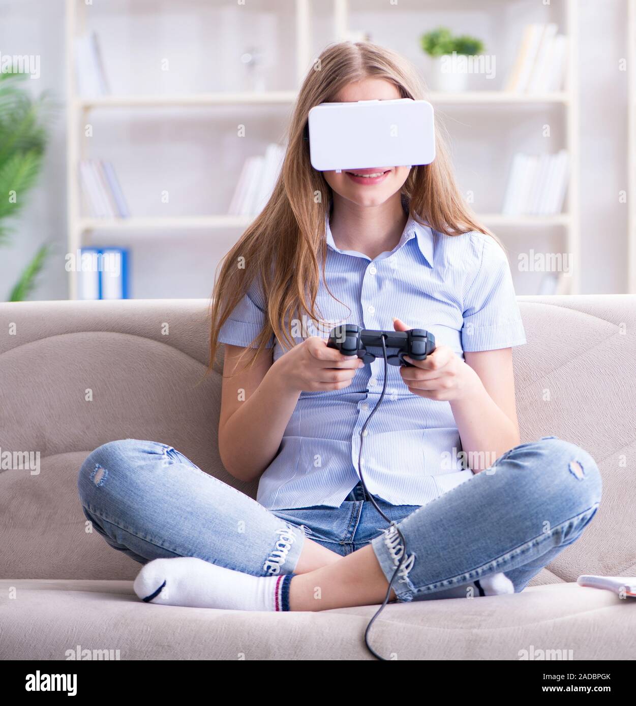 Young girl playing virtual reality games Stock Photo - Alamy