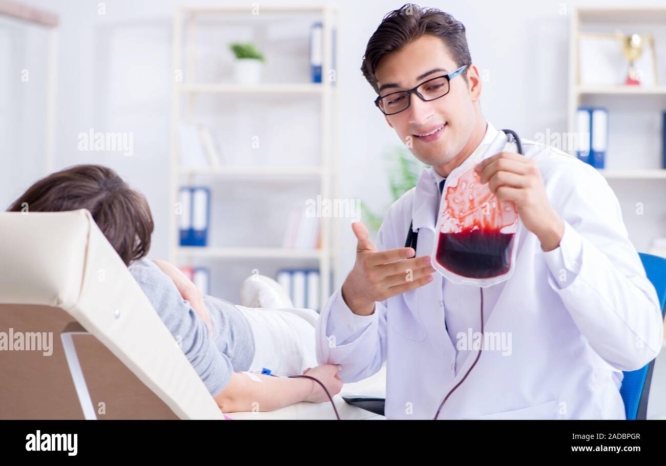 The patient getting blood transfusion in hospital clinic Stock Photo ...
