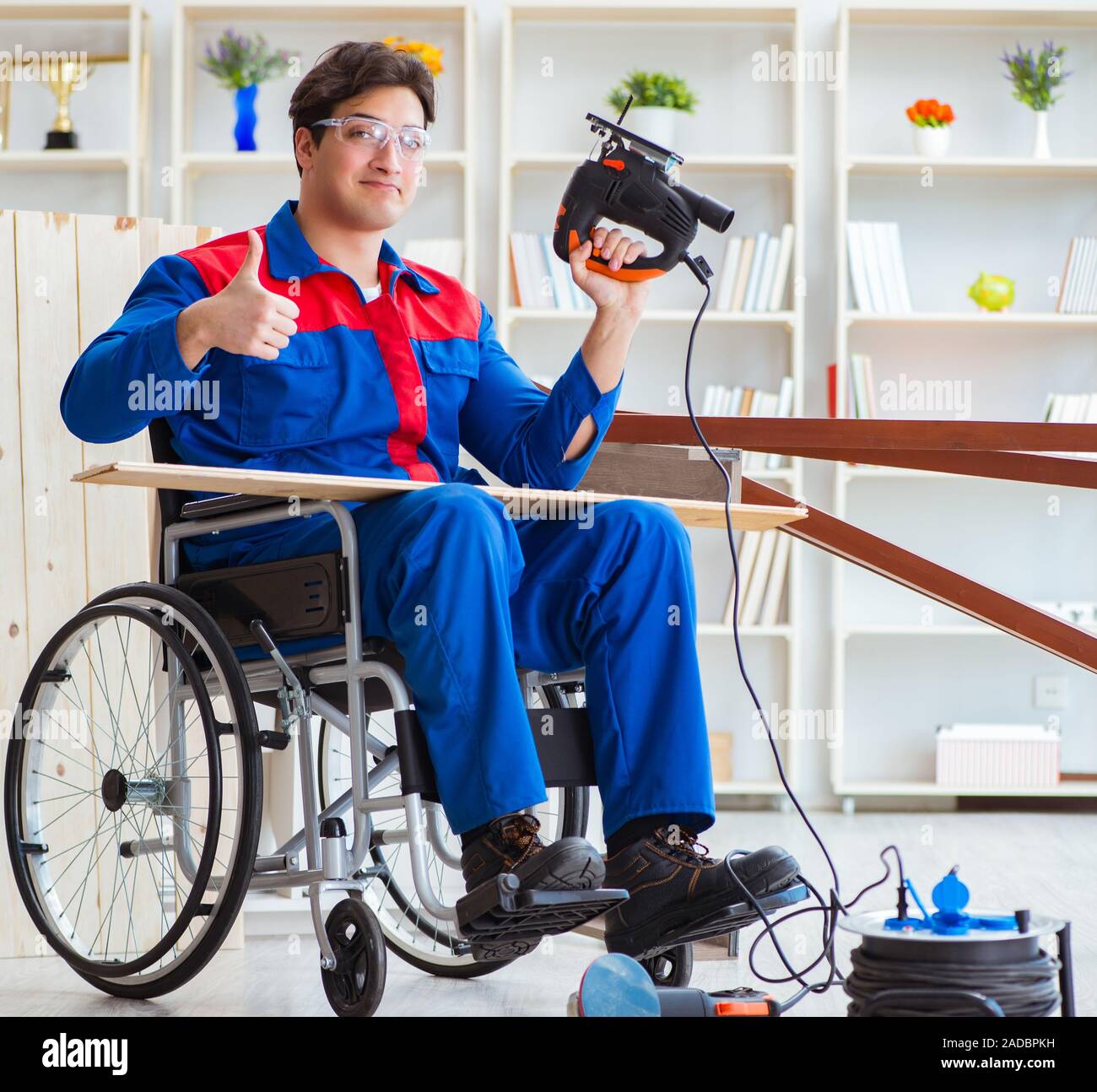 Disabled man working with circular saw Stock Photo - Alamy