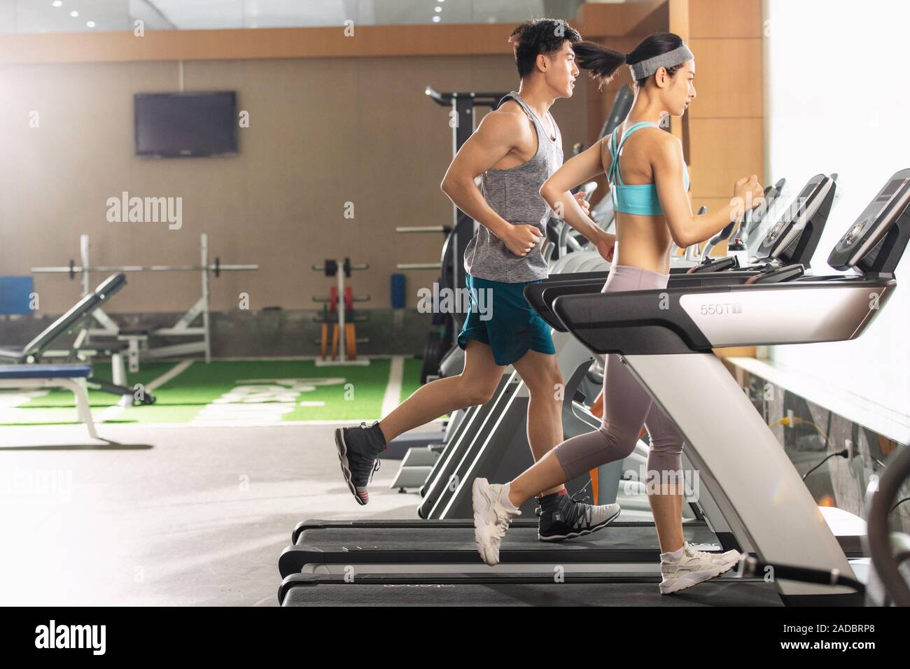 Young people in the gym to work out Stock Photo - Alamy