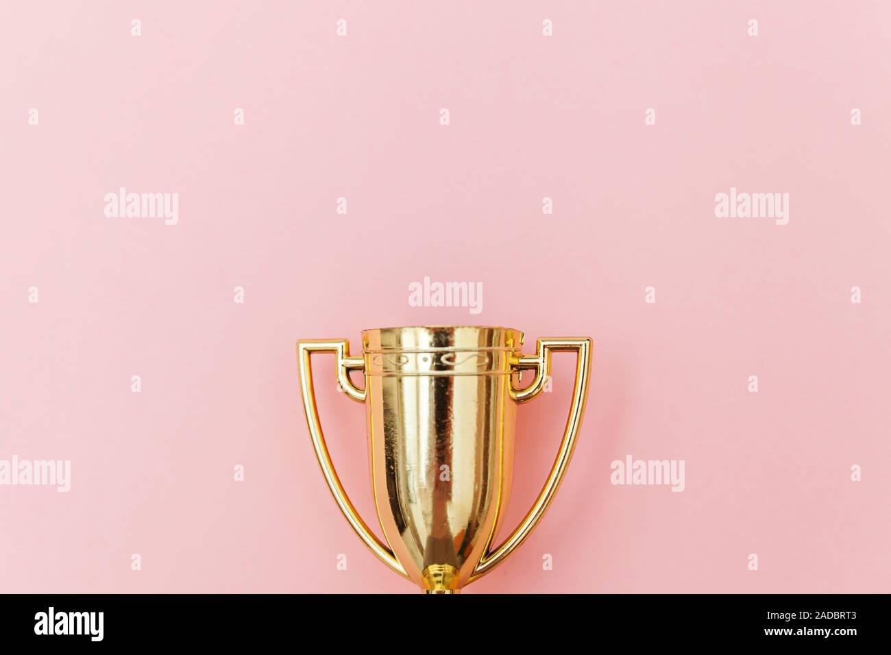 Simply flat lay design winner or champion gold trophy cup isolated on ...