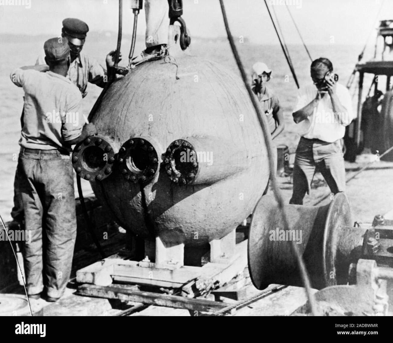 Beebe Bathysphere. Men working with William Beebe's bathysphere onboard ...