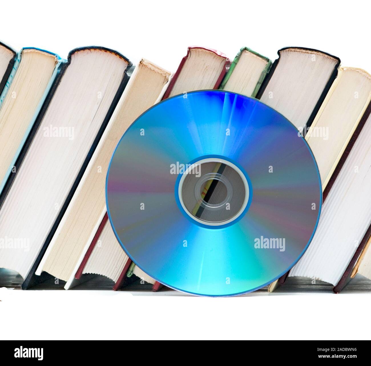 Row of books and DVD disk as symbols of old and new methods of ...