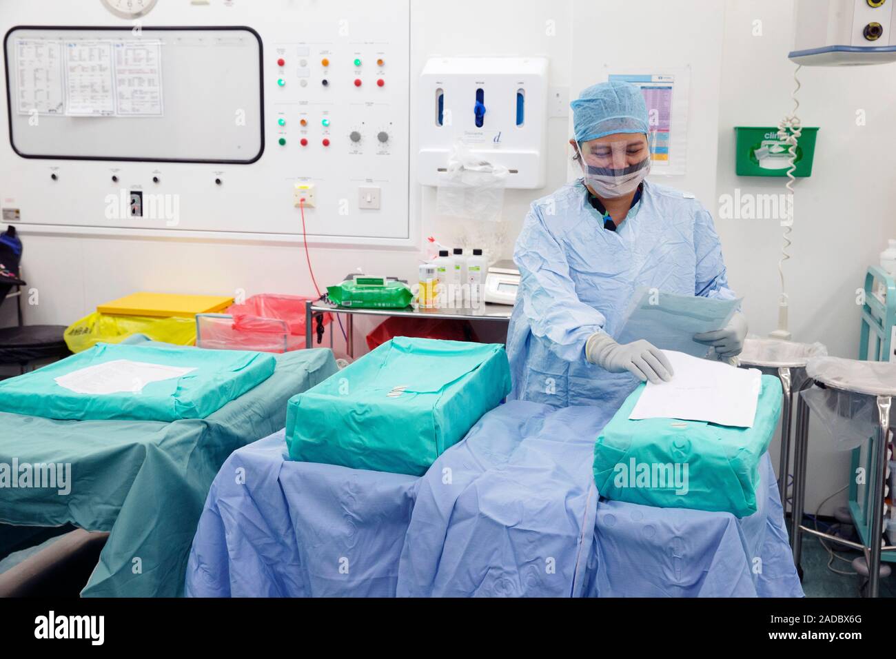 Hospital technician at work. Hospital technician preparing sterile ...