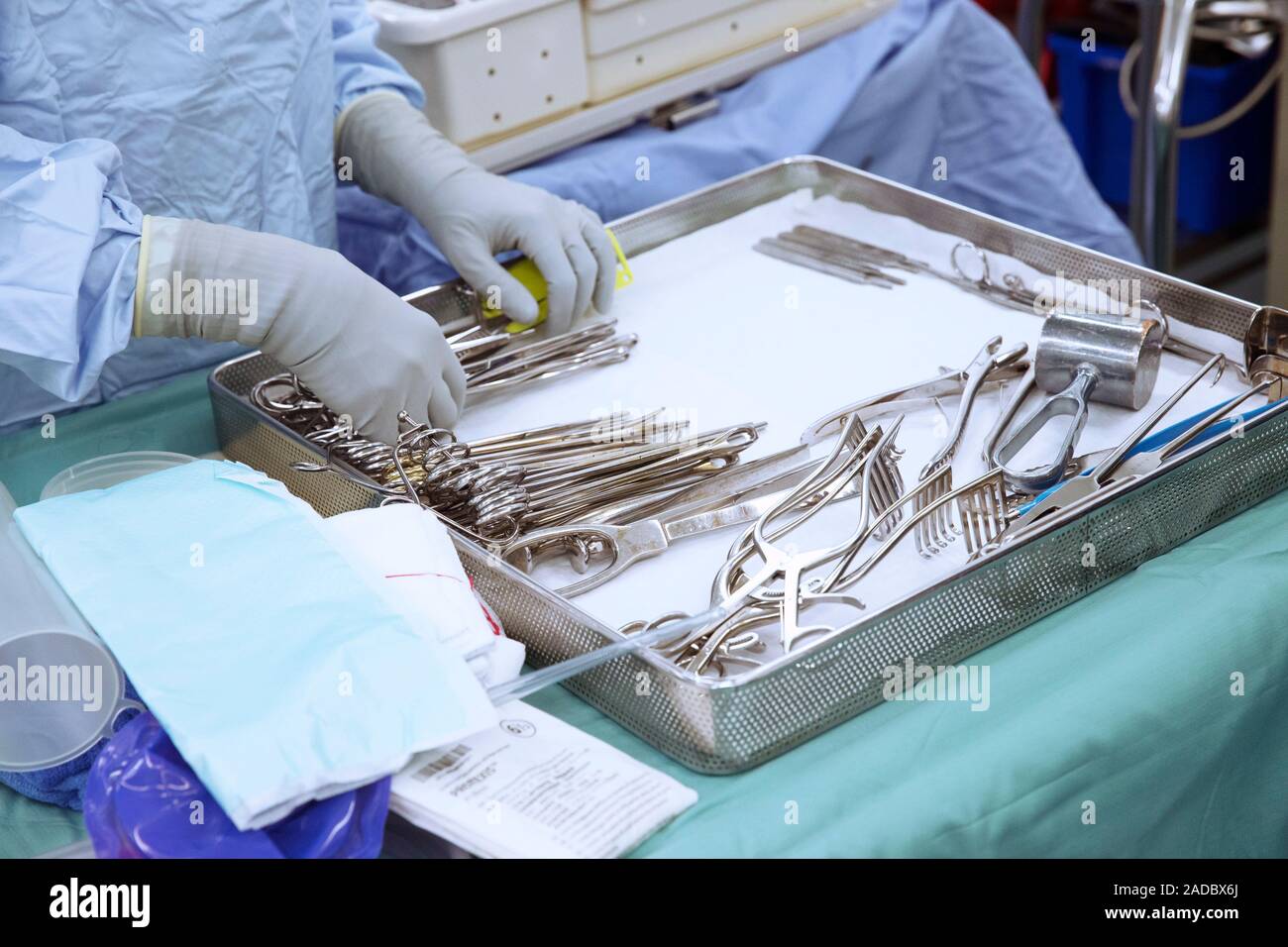 Preparing for surgery. Hospital technician preparing sterile surgical ...