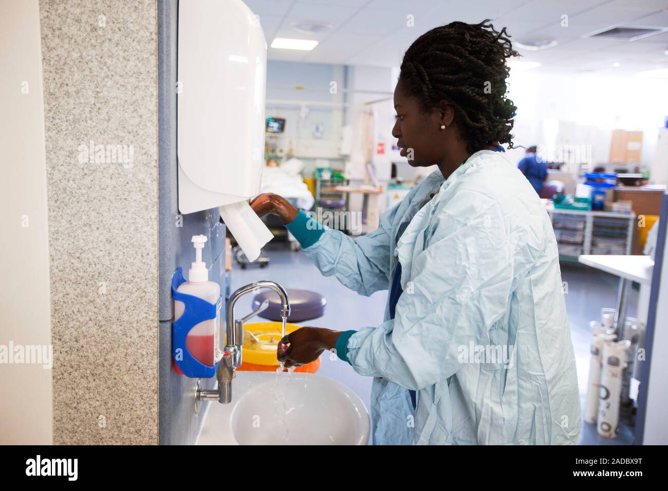 Doctor at work. Doctor washing her hands on a hospital ward Stock Photo ...