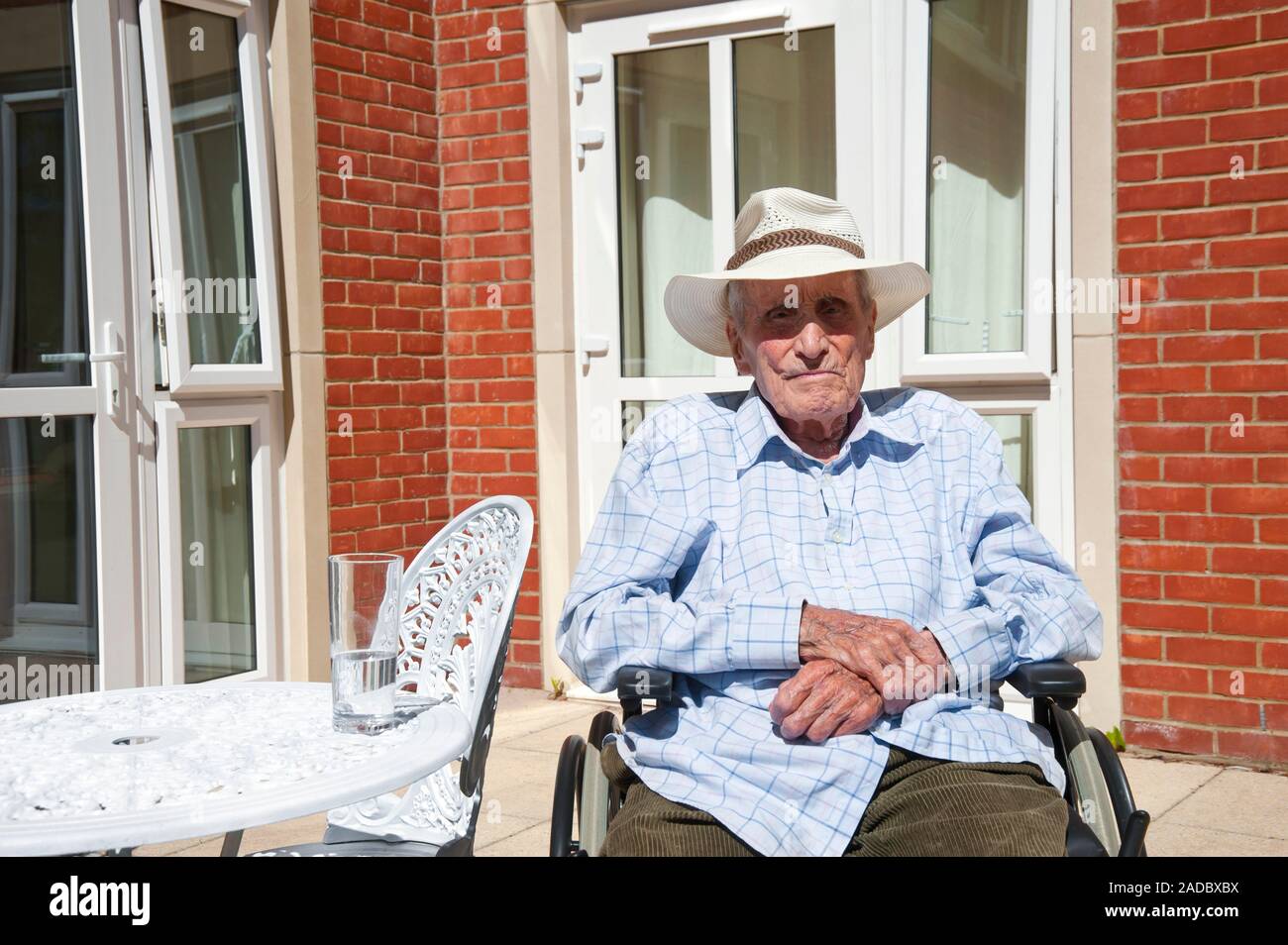 Joe Powell (1922-2016), former British stuntman, in a wheelchair on a ...