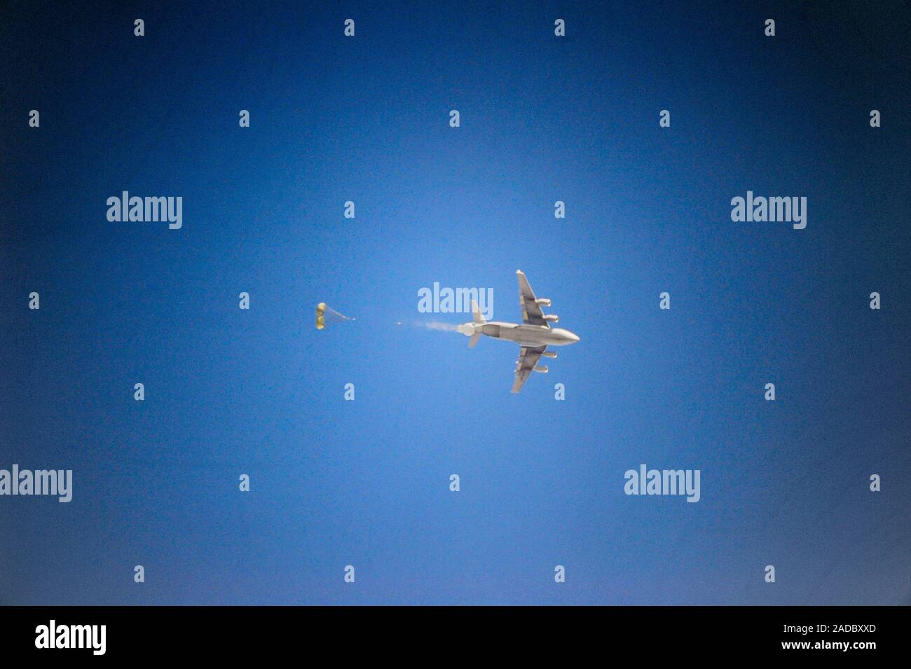 Orion parachute drop testing. C-17 airplane dropping a test version of ...