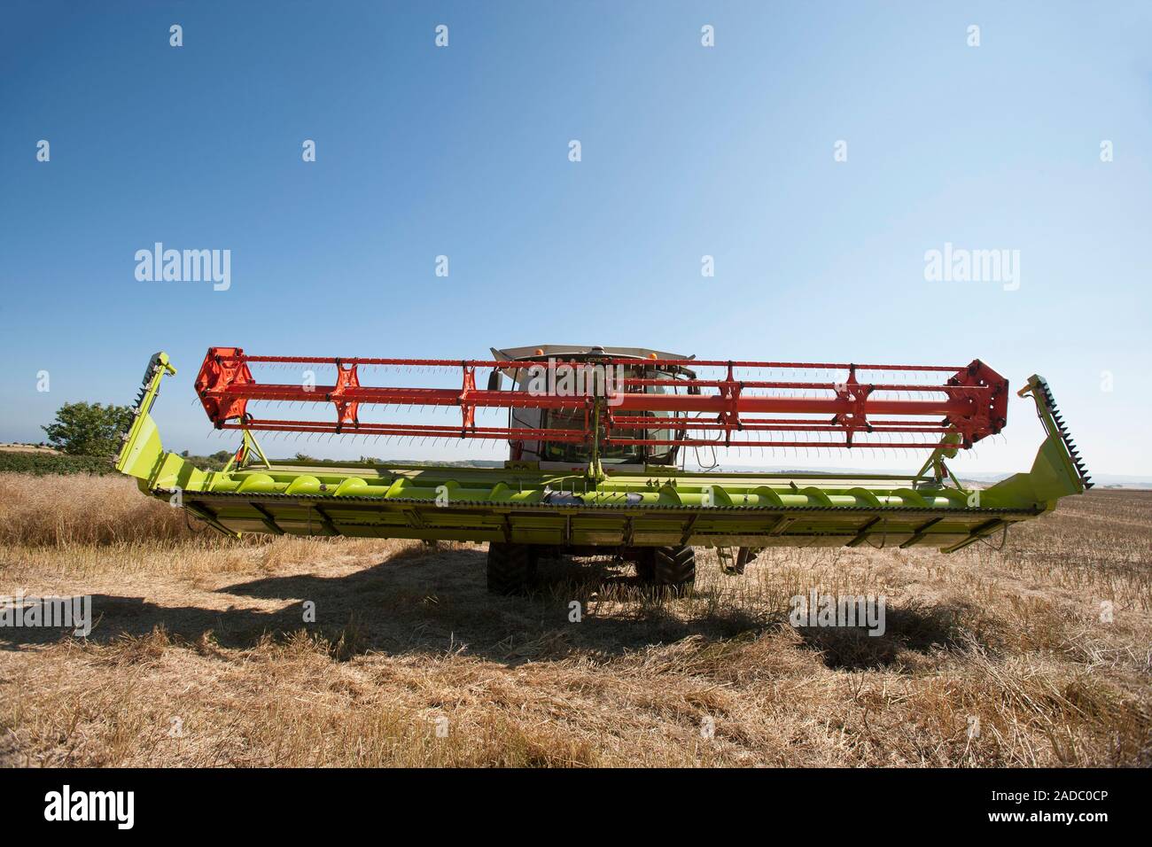 Combine harvester. Front view of the blades of a combine harvester that ...