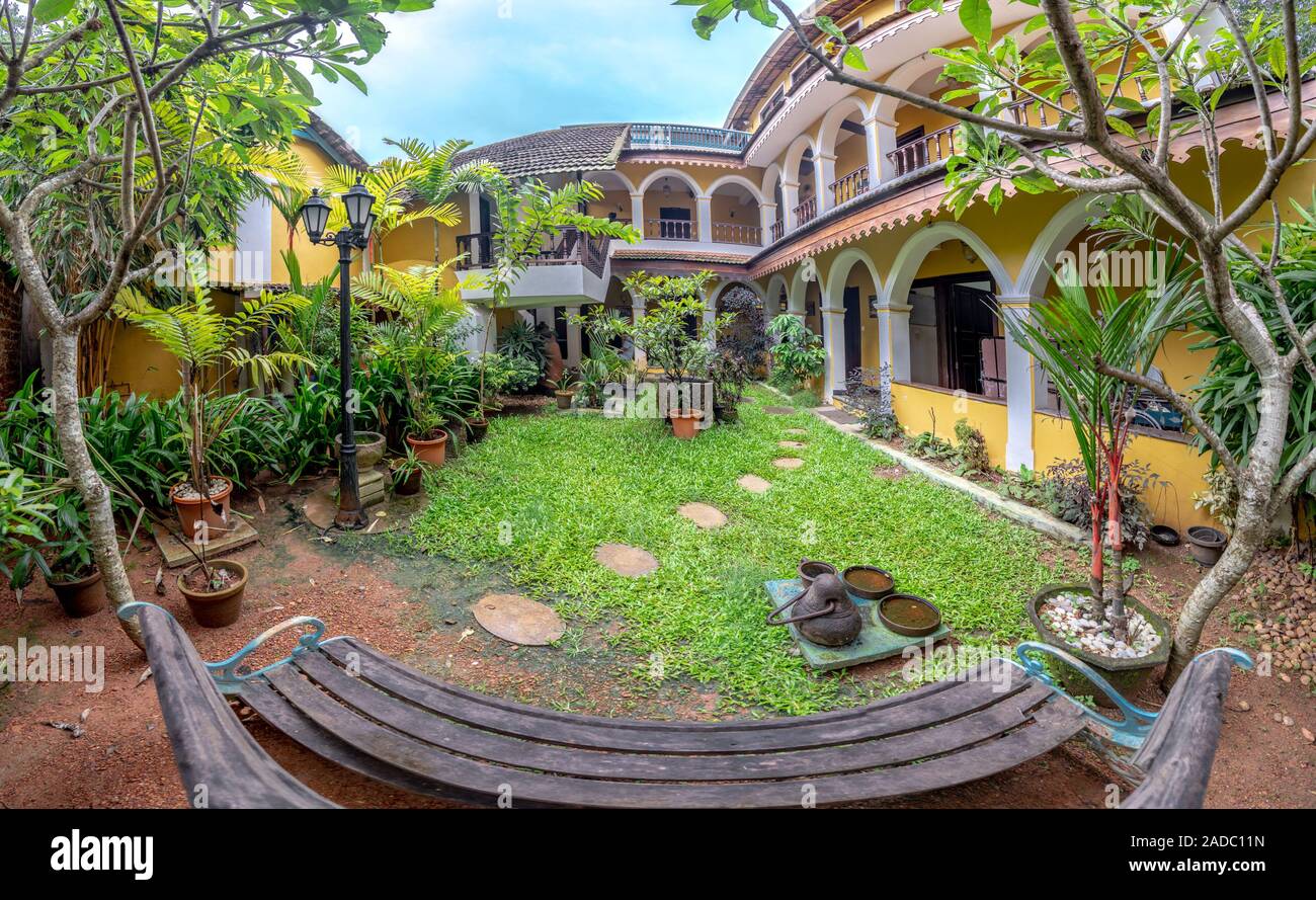 Enclosed green courtyard for relaxing in hotel with trees Stock Photo ...
