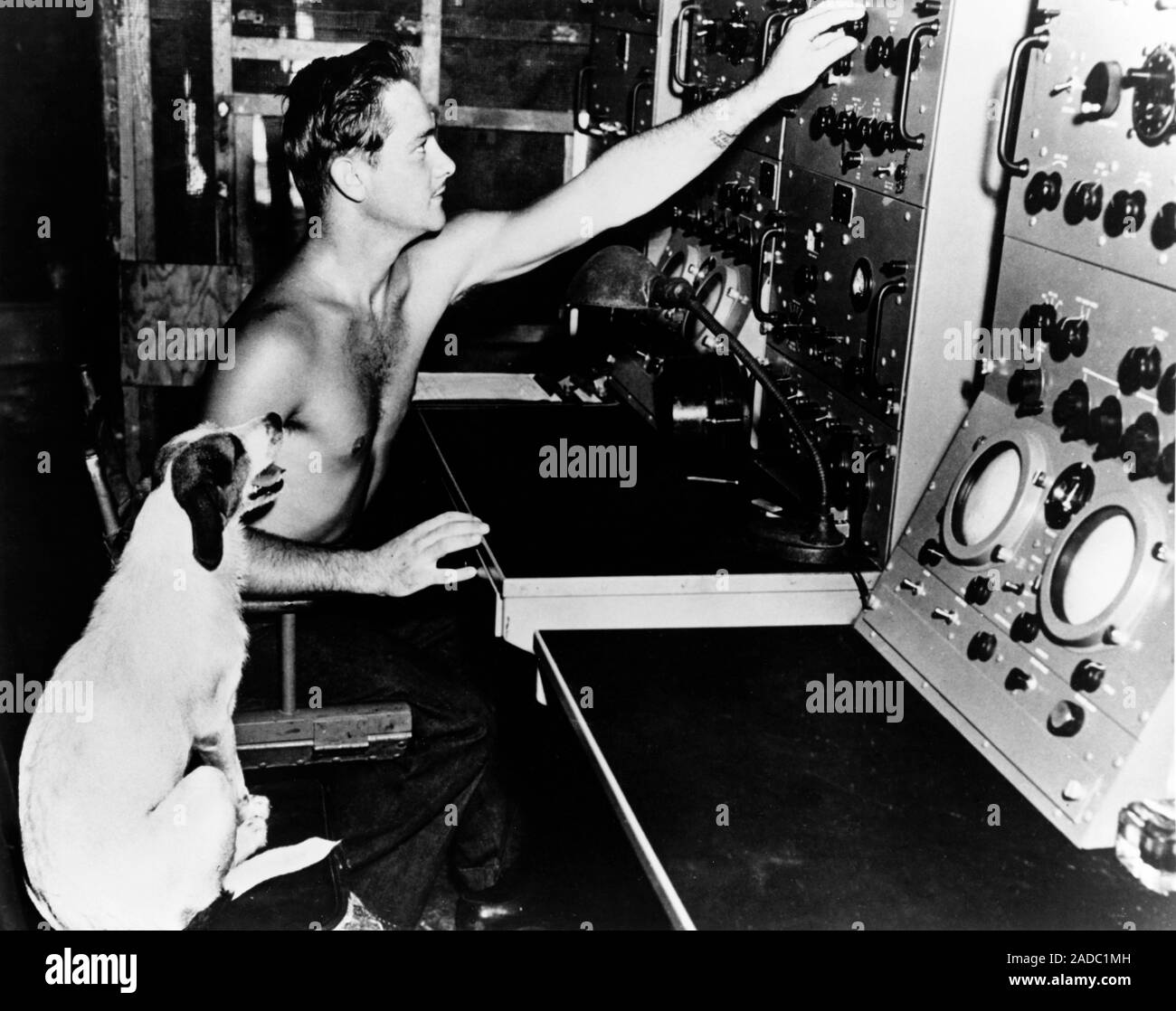 Watch stander monitoring instruments at a US Coast Guard long range ...