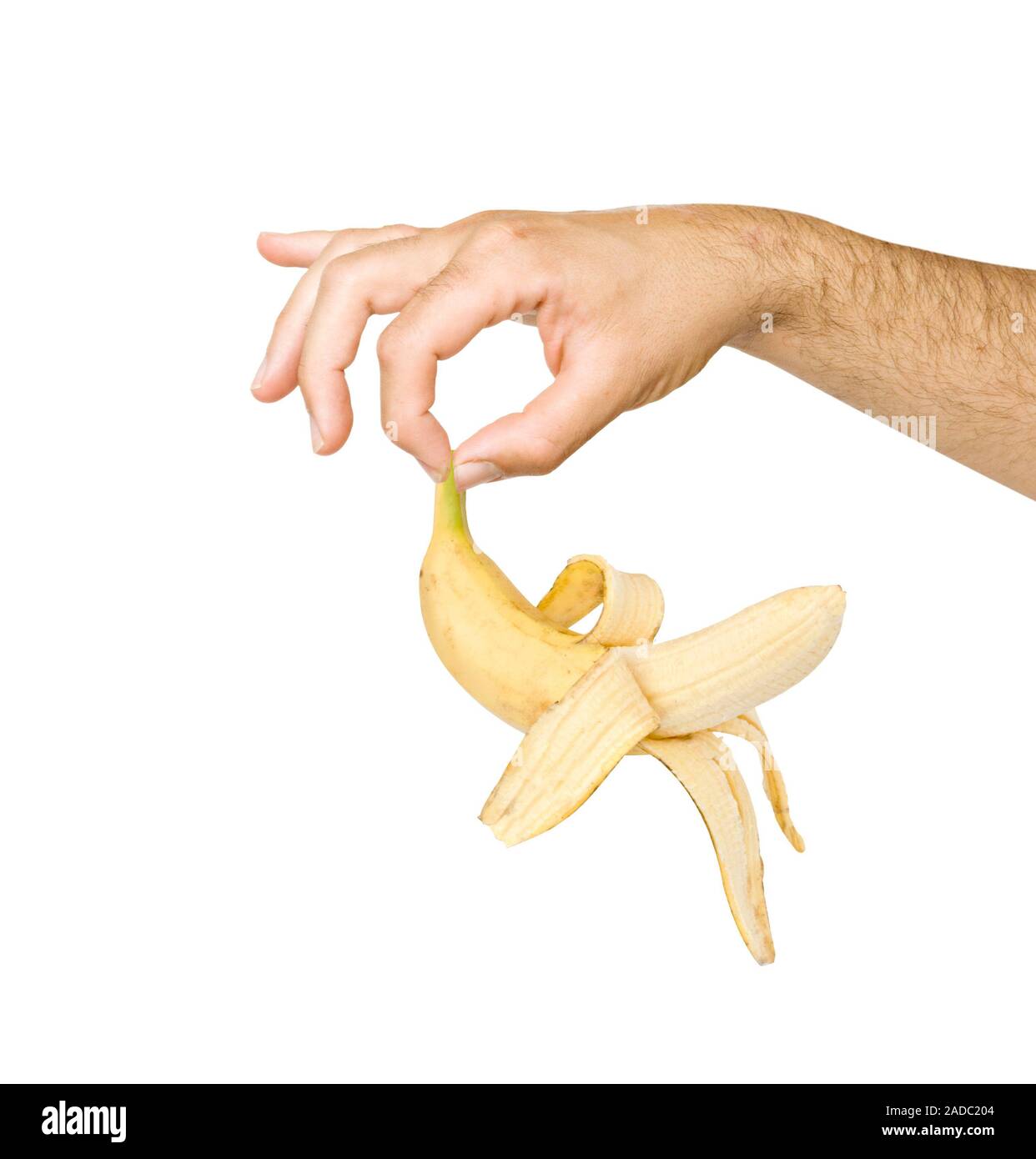 Banana in hand isolated on white background Stock Photo - Alamy