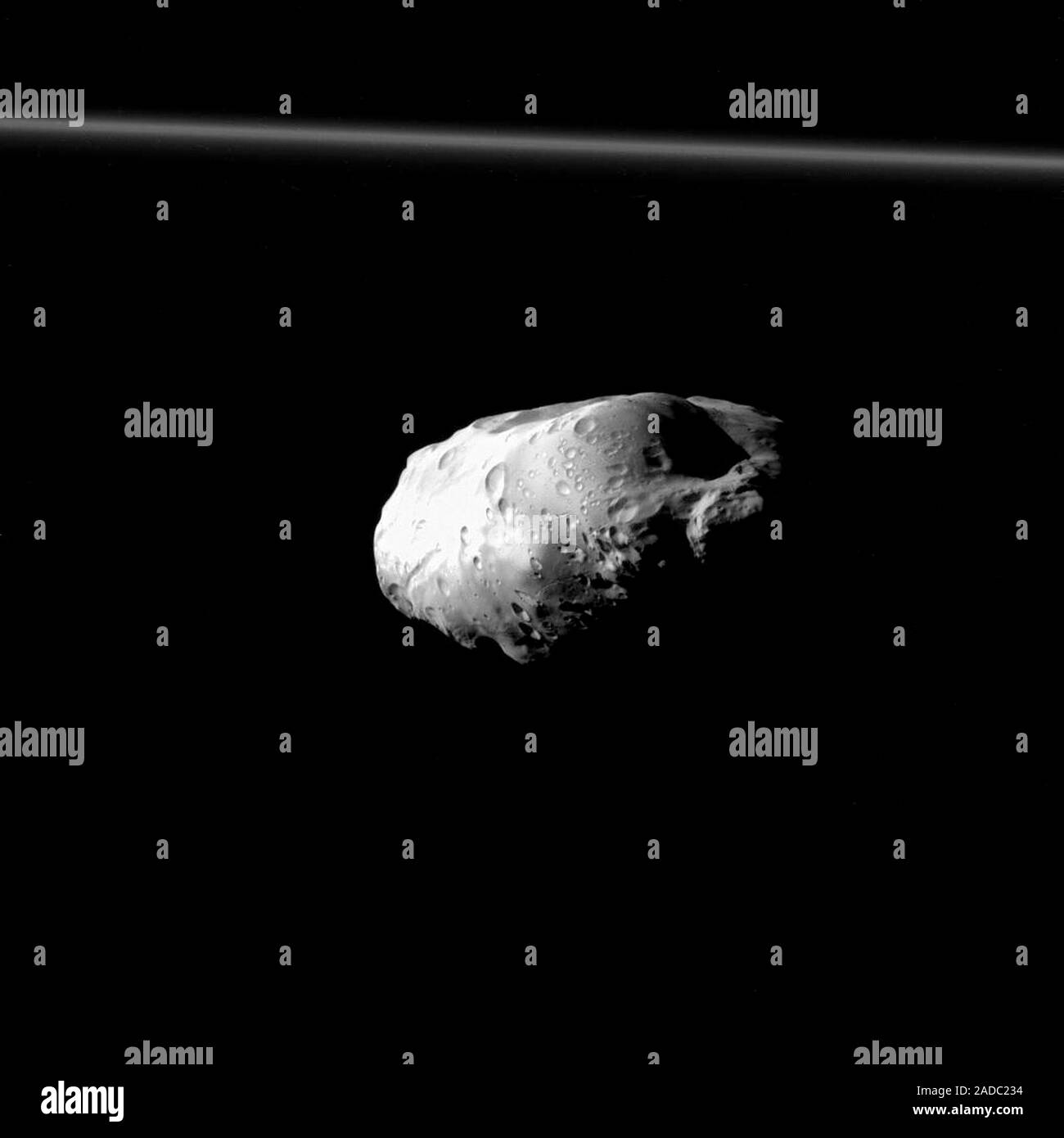 Saturn's moon Prometheus, Cassini image. This small moon of Saturn is ...