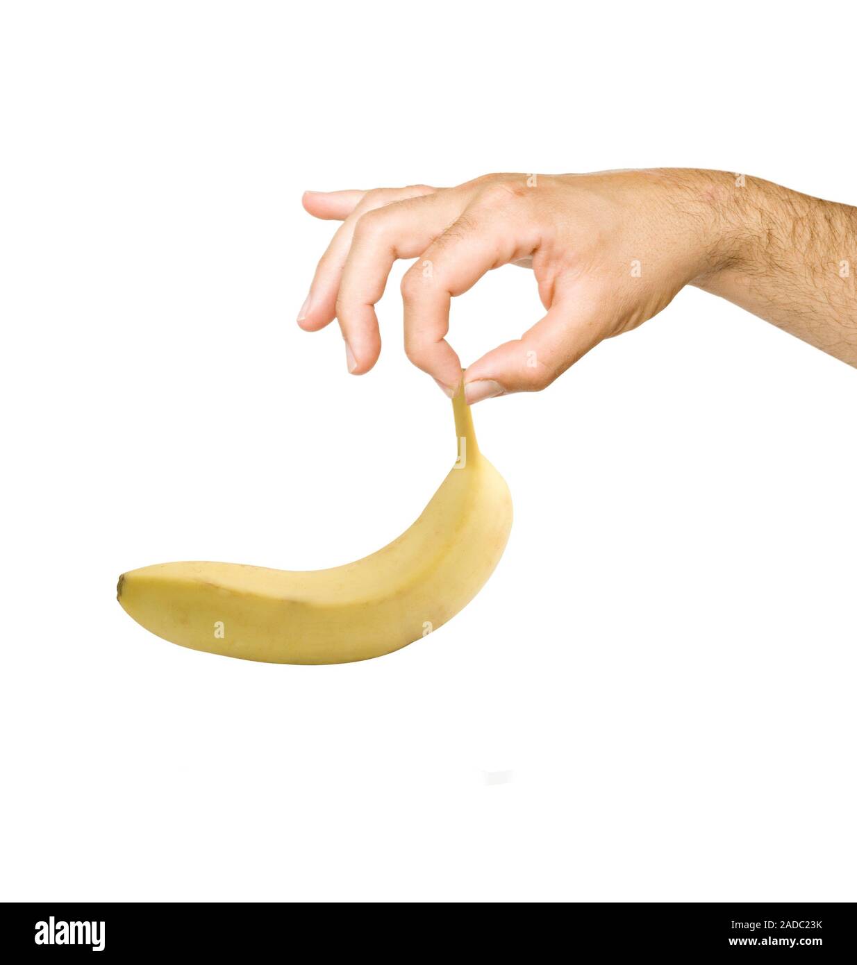 Banana in hand isolated on white background Stock Photo - Alamy